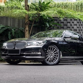 Stylish BMW 750Li on Black Custom Wheels by Exclusive Motoring — CARiD ...